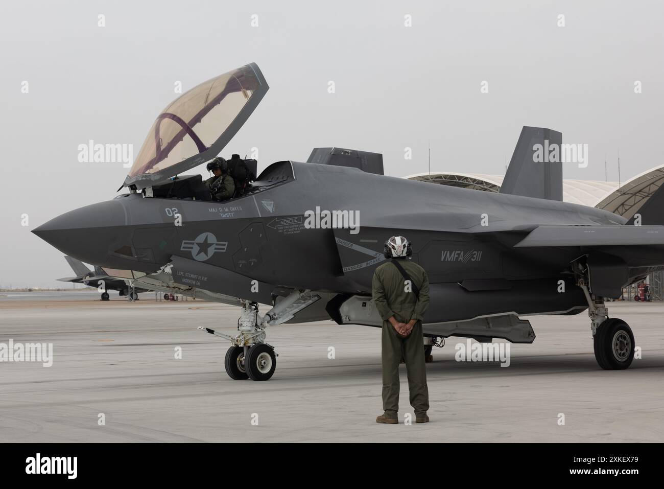 U.S. Marine Corps Capt. Cassandra Touchstone, left, an F-35C Lightning ...