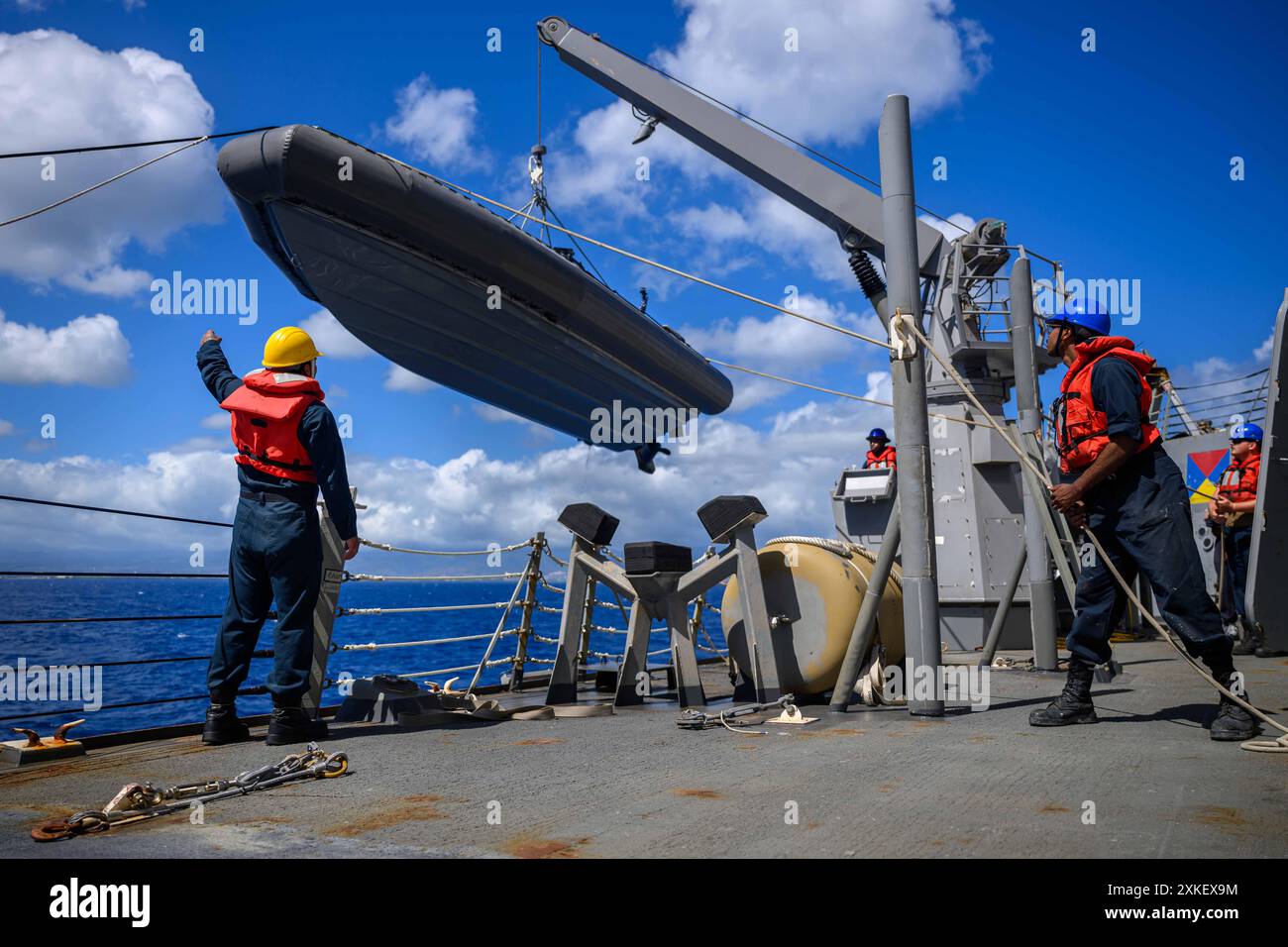 Boatswain’s Mate 2nd Class Thomas Cantu, left, assigned to the Arleigh ...