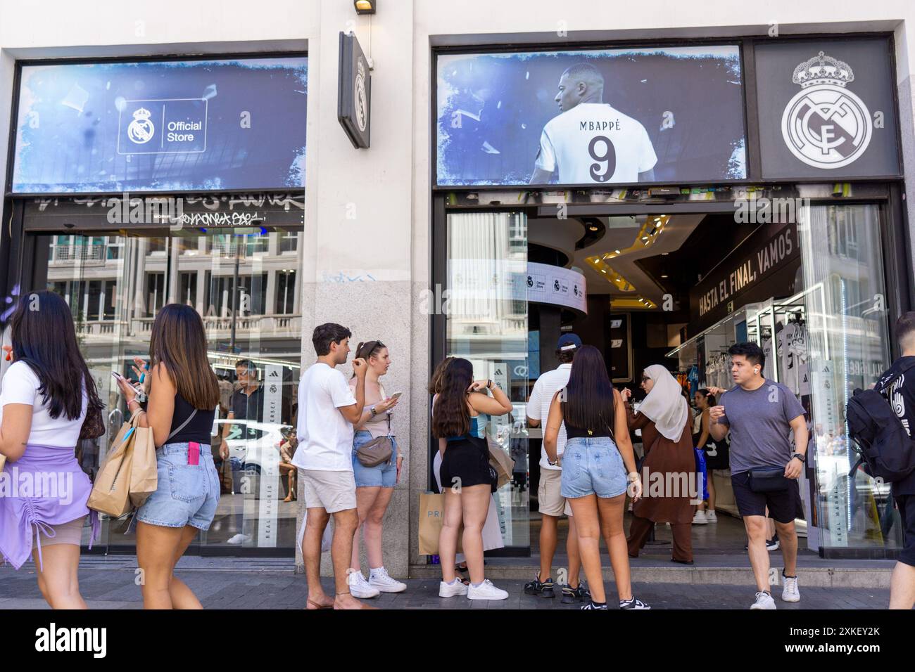 Madrid, Spain. 22nd July, 2024. A group of people queue to enter the ...