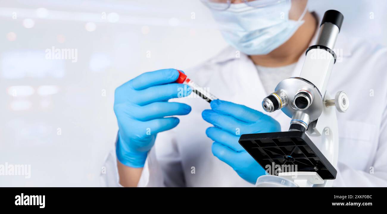 Technician holding blood tube test in the research laboratory ...