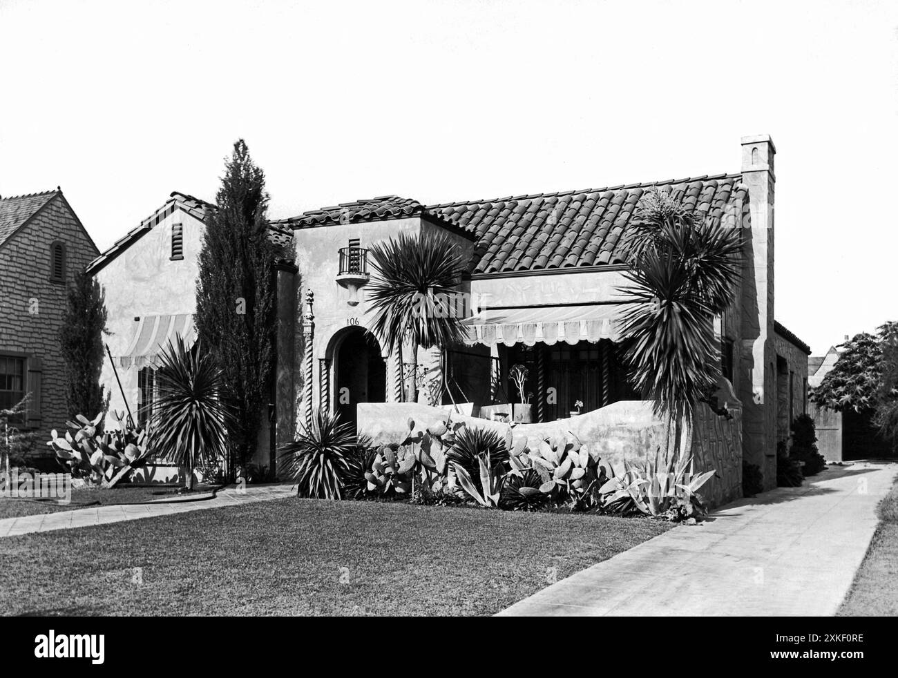 Los Angeles, California c. 1930. A typical bungalow home with a lawn ...