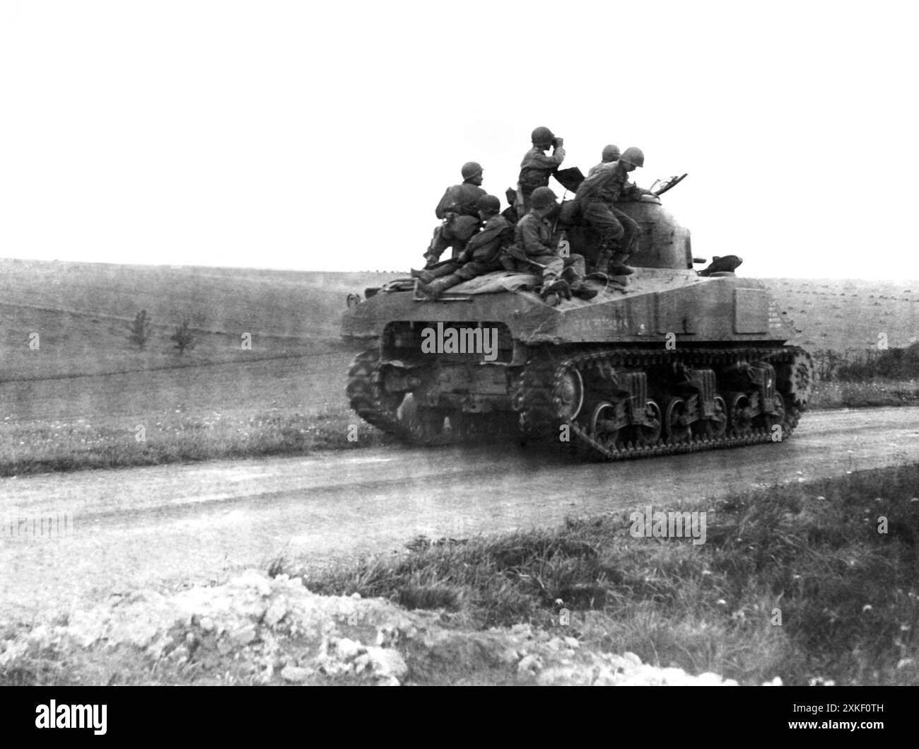 France May 9, 1944 A U.S. Army tank carrying some Yank infantrymen ...