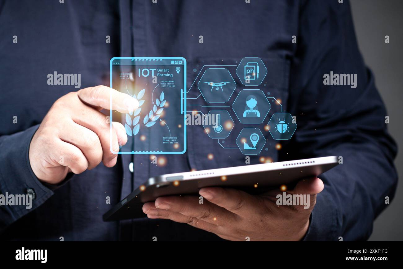Man point the IoT Smart farm on the tablet virtual screen. Application ...