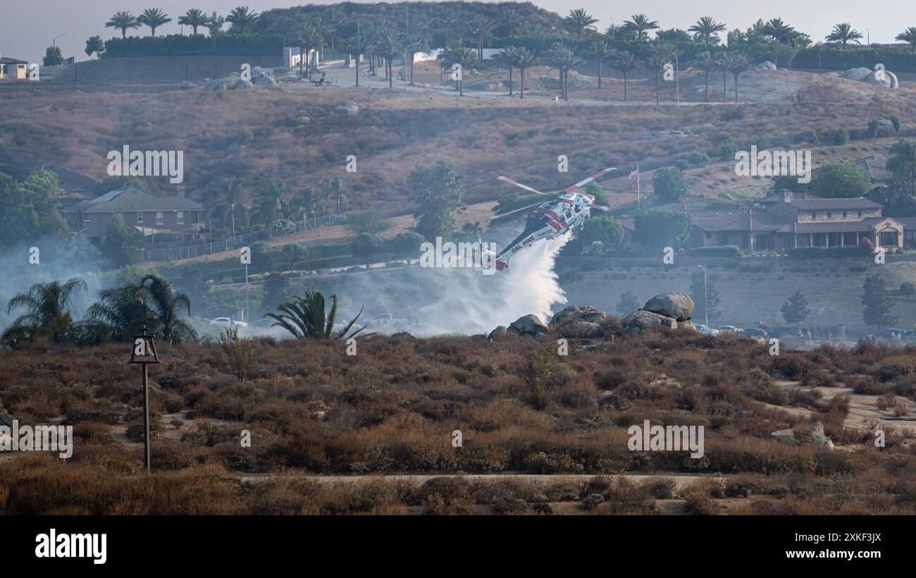 Riverside, United States. 21st July, 2024. A Cal Fire helicopter makes ...
