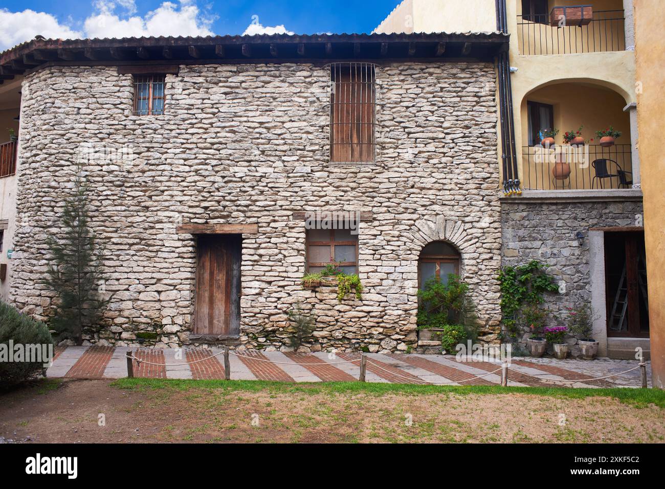 Two-story stone building on a downtown street during a quiet day Stock ...