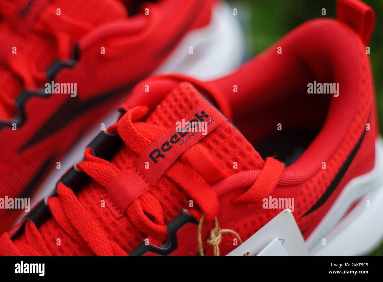 Tyumen, Russia-June 20, 2024: Reebok red sneakers logo. Reebok is a ...