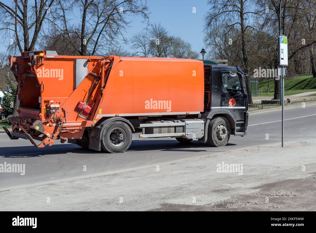 Garbage Truck Driving Down The City Street. Municipal Recycling Waste ...