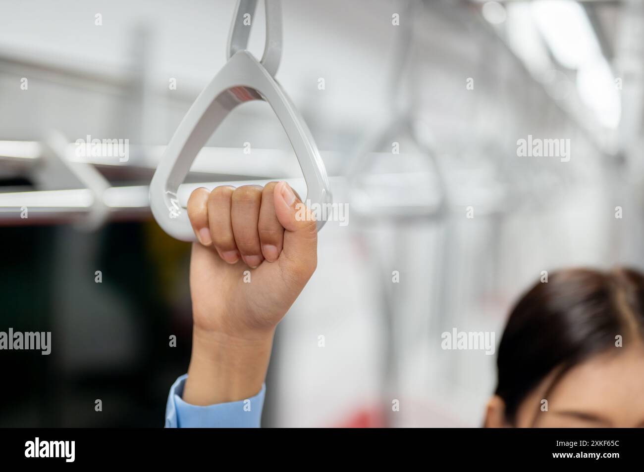 Woman holding subway handrail commuting hi-res stock photography and ...