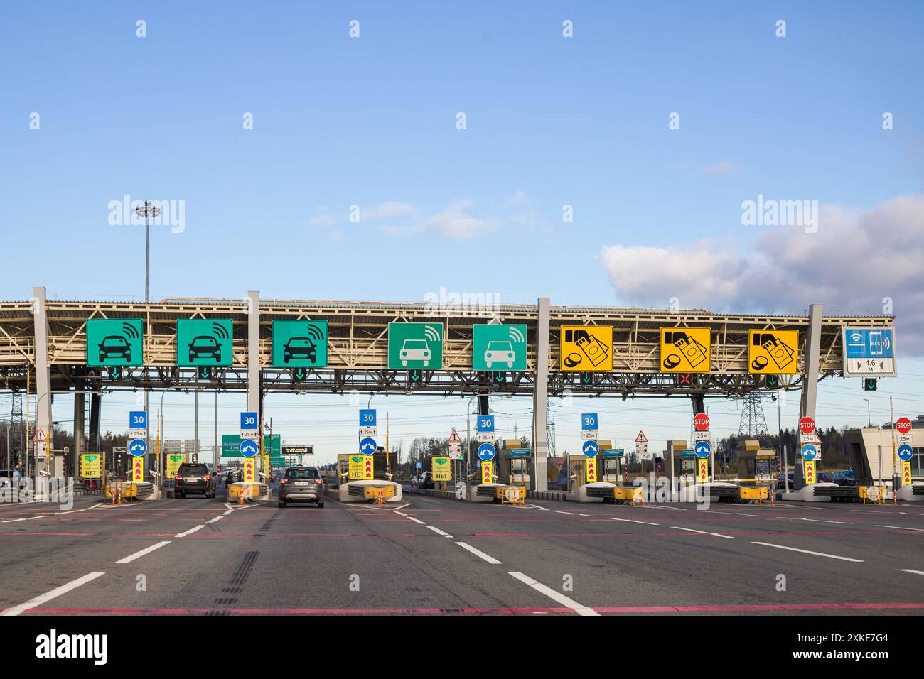 The car pays the cashier for the entrance to the motorway toll gate ...