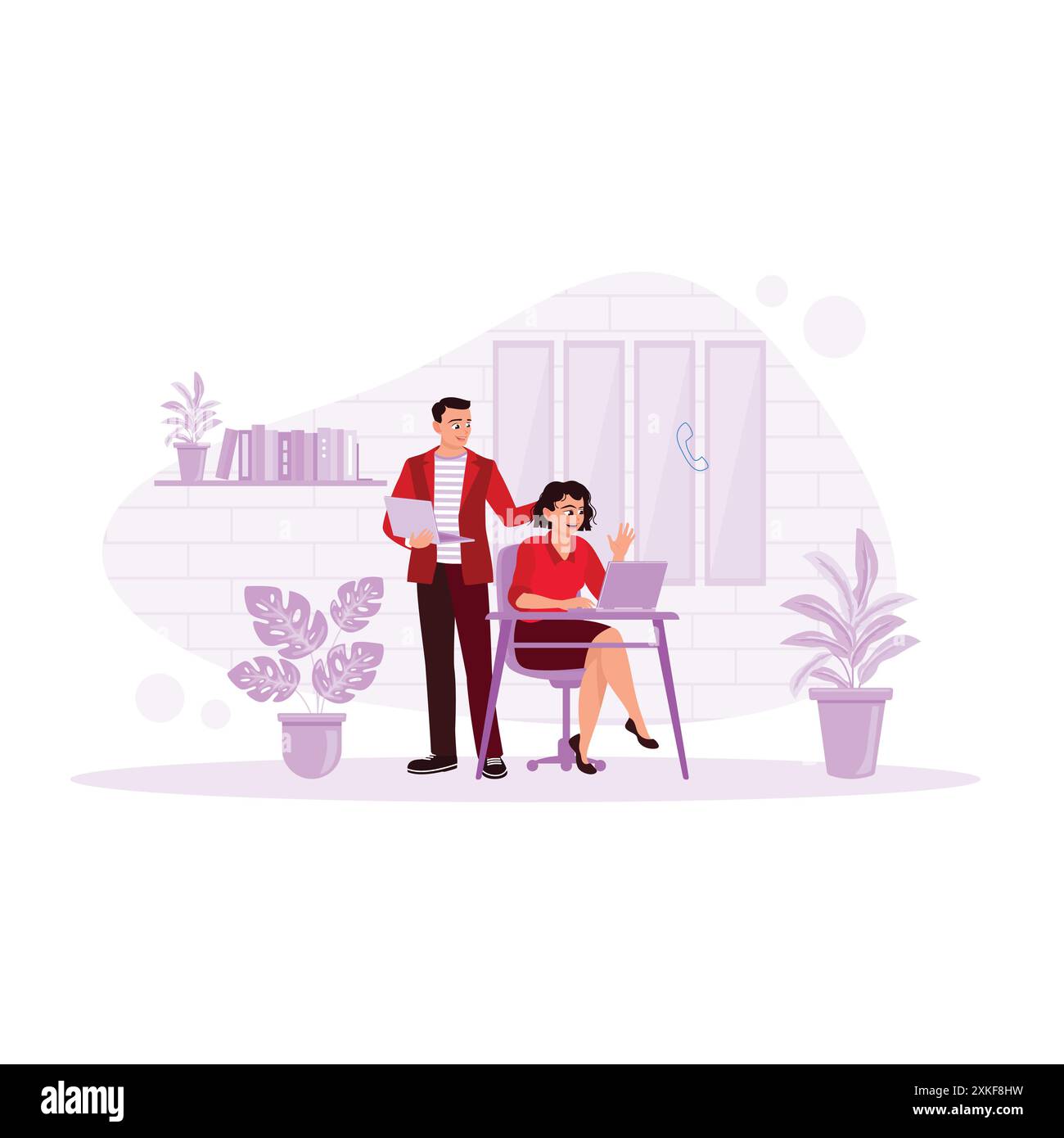 Happy coworkers using laptop computers while working. They work ...