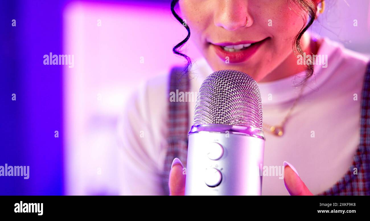 Neon, influencer and girl with microphone live streaming, talking and ...