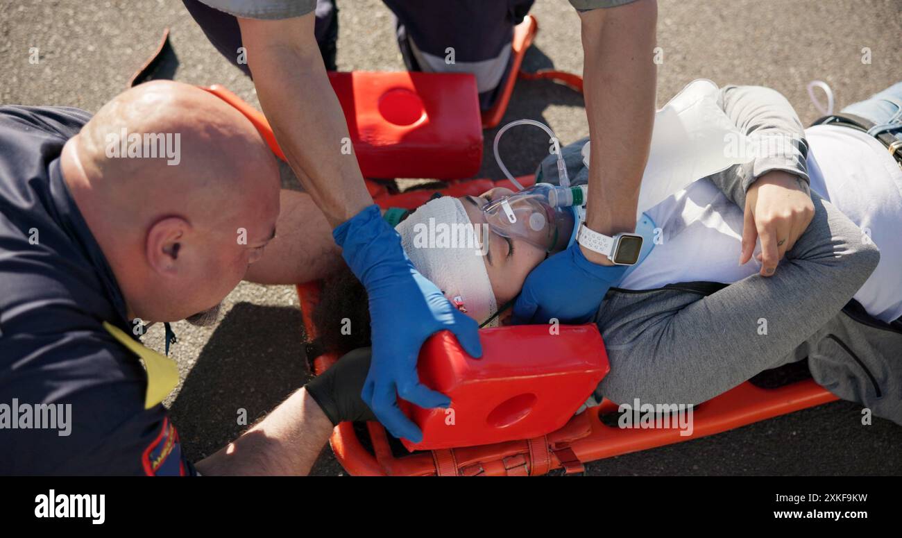 Paramedic, emergency and road injury with traffic accident, healthcare ...