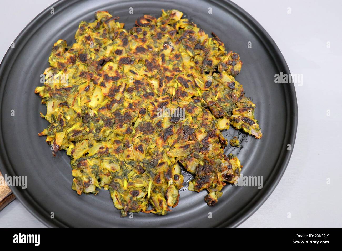 Methi chi Vadi or Methi Thalipeeth. It is a healthy snack made with ...