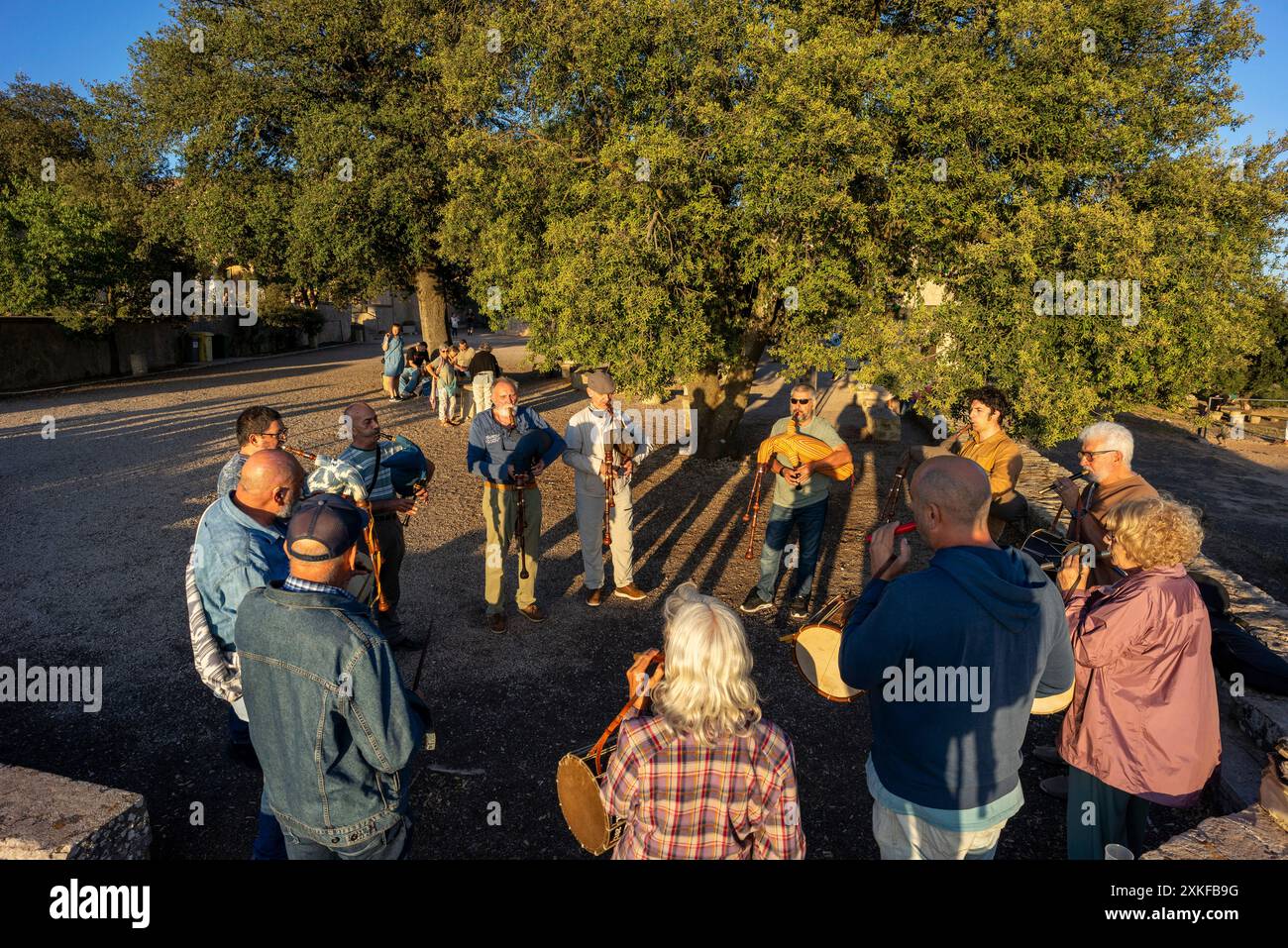 Group of traditional Mallorcan musicians having fun, terrace in the ...