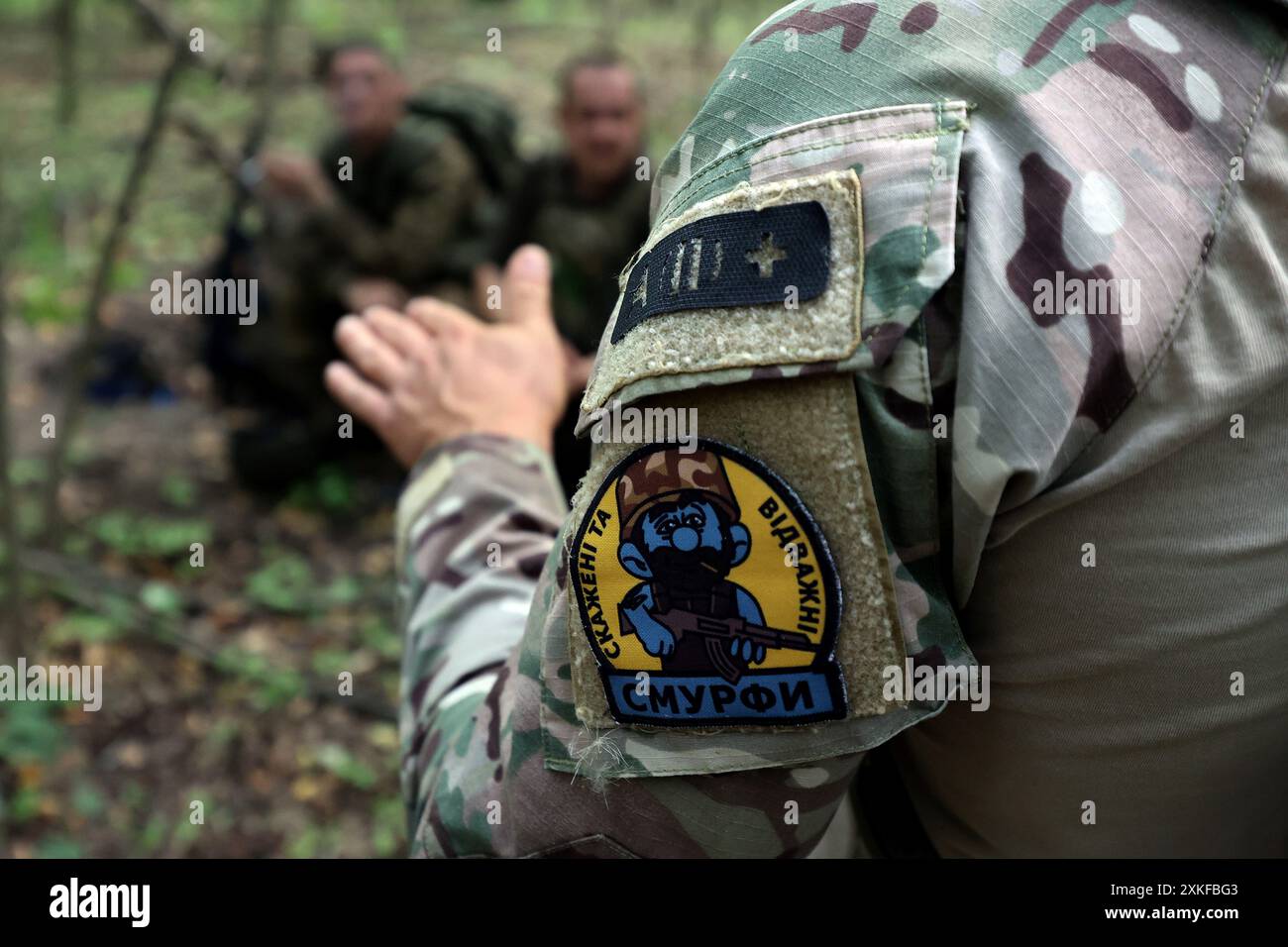 UKRAINE - JULY 22, 2024 - A shoulder sleeve patch is on a serviceman of ...