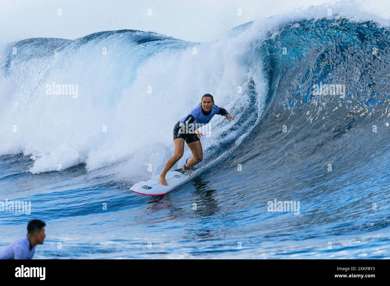 Sarah Baum of team South Africa surfs a wave on a training day before ...
