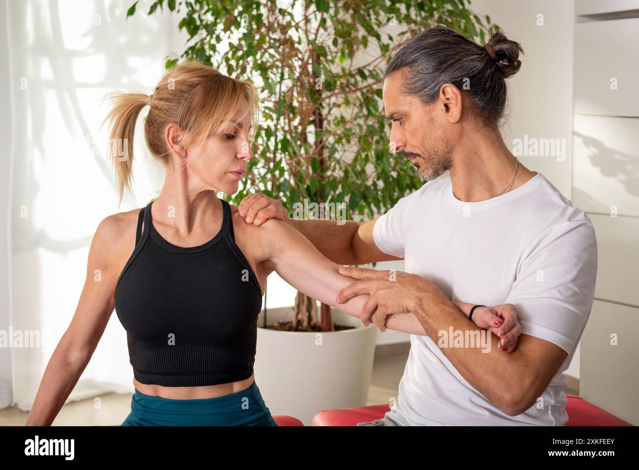 Female physiotherapist performing therapeutic hi-res stock photography ...
