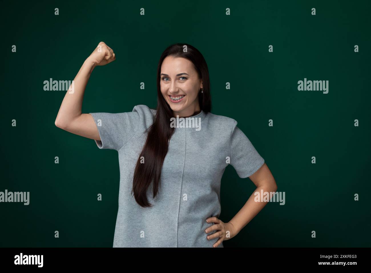 Woman Posing With Arms Raised Stock Photo - Alamy