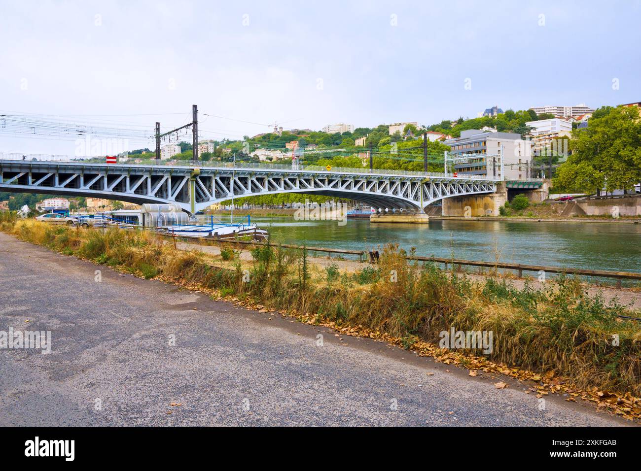 French regional express train crossing Saone river on metal railway ...