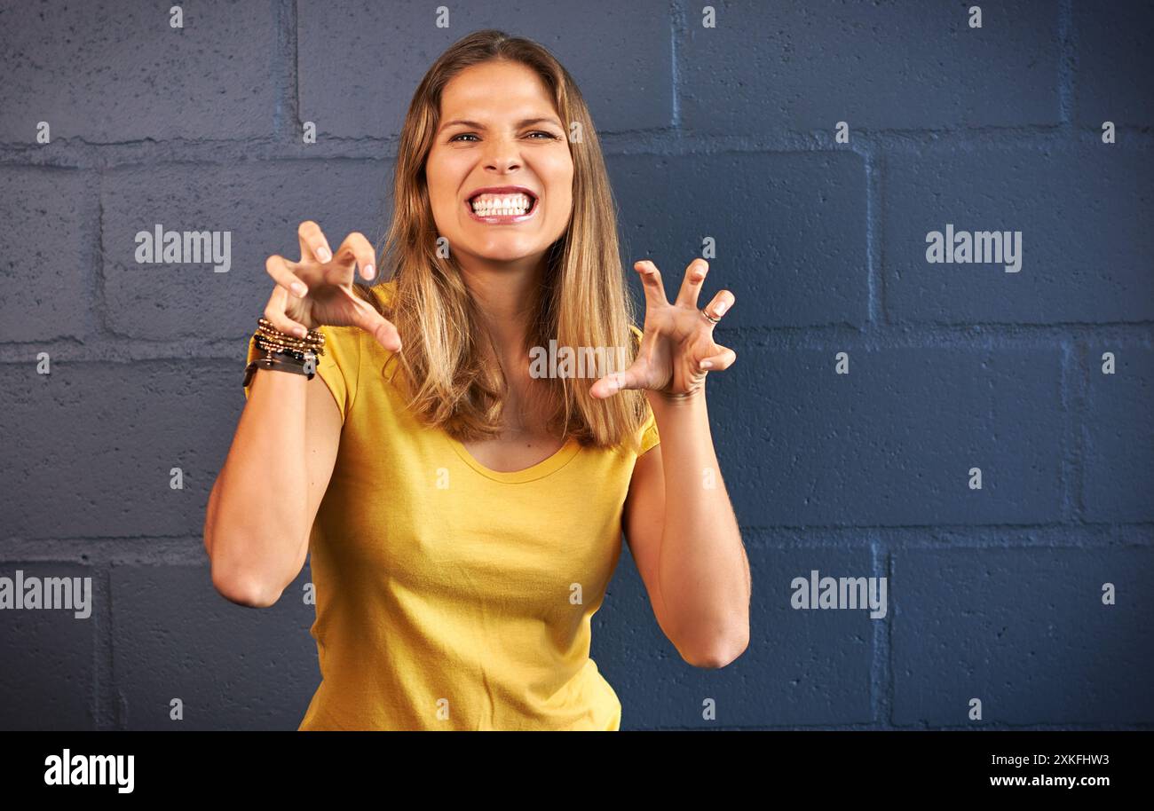 Woman, happy portrait and hand claws with mockup, fun entertainment and ...