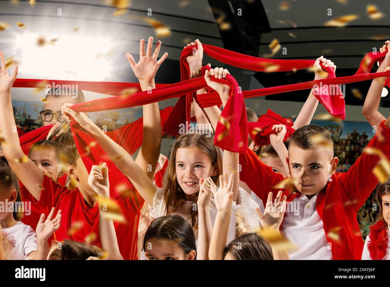 Group of enthusiastic children, dressed in red and white, wave red ...
