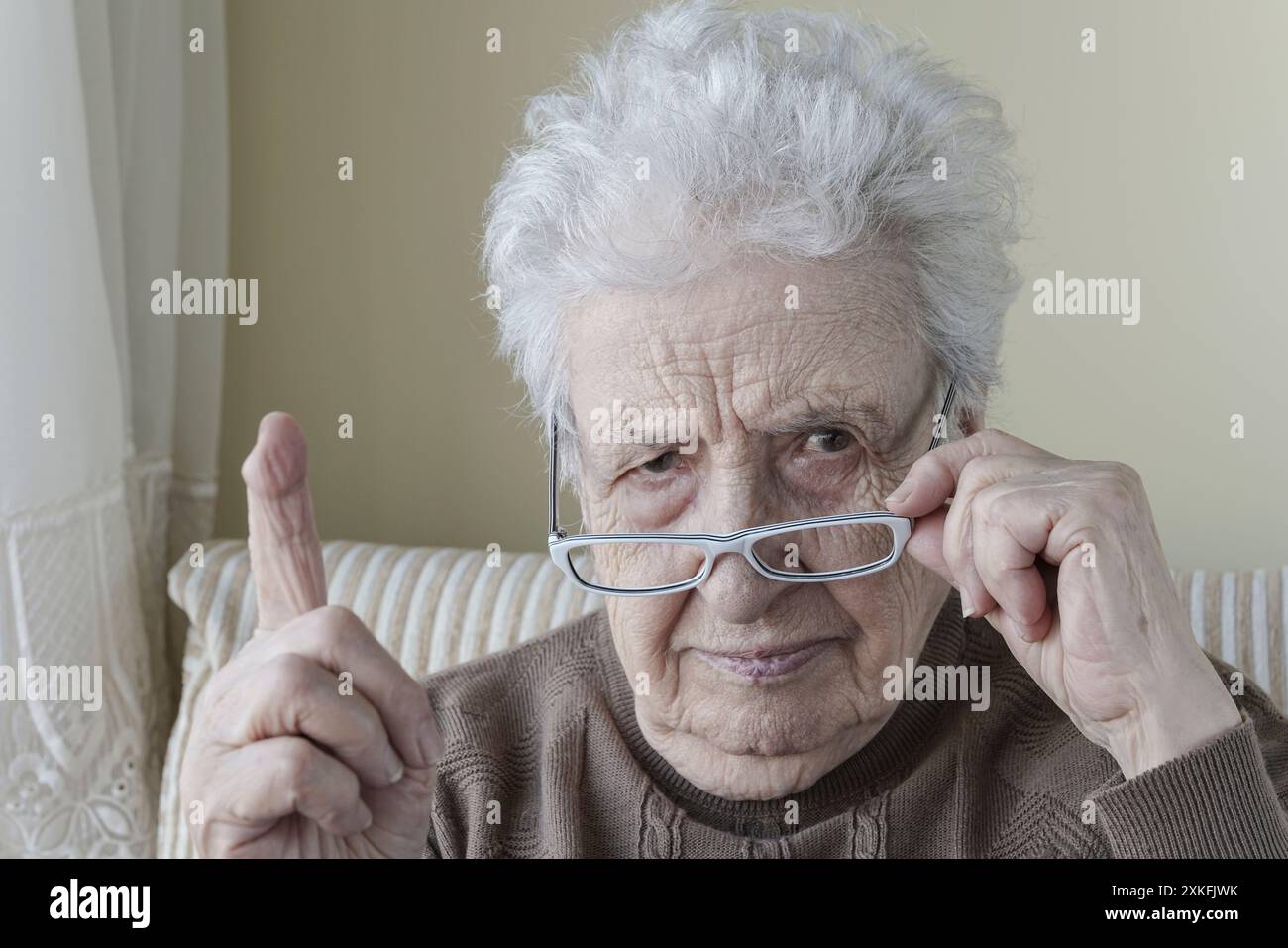 Angry aged woman warning hi-res stock photography and images - Alamy