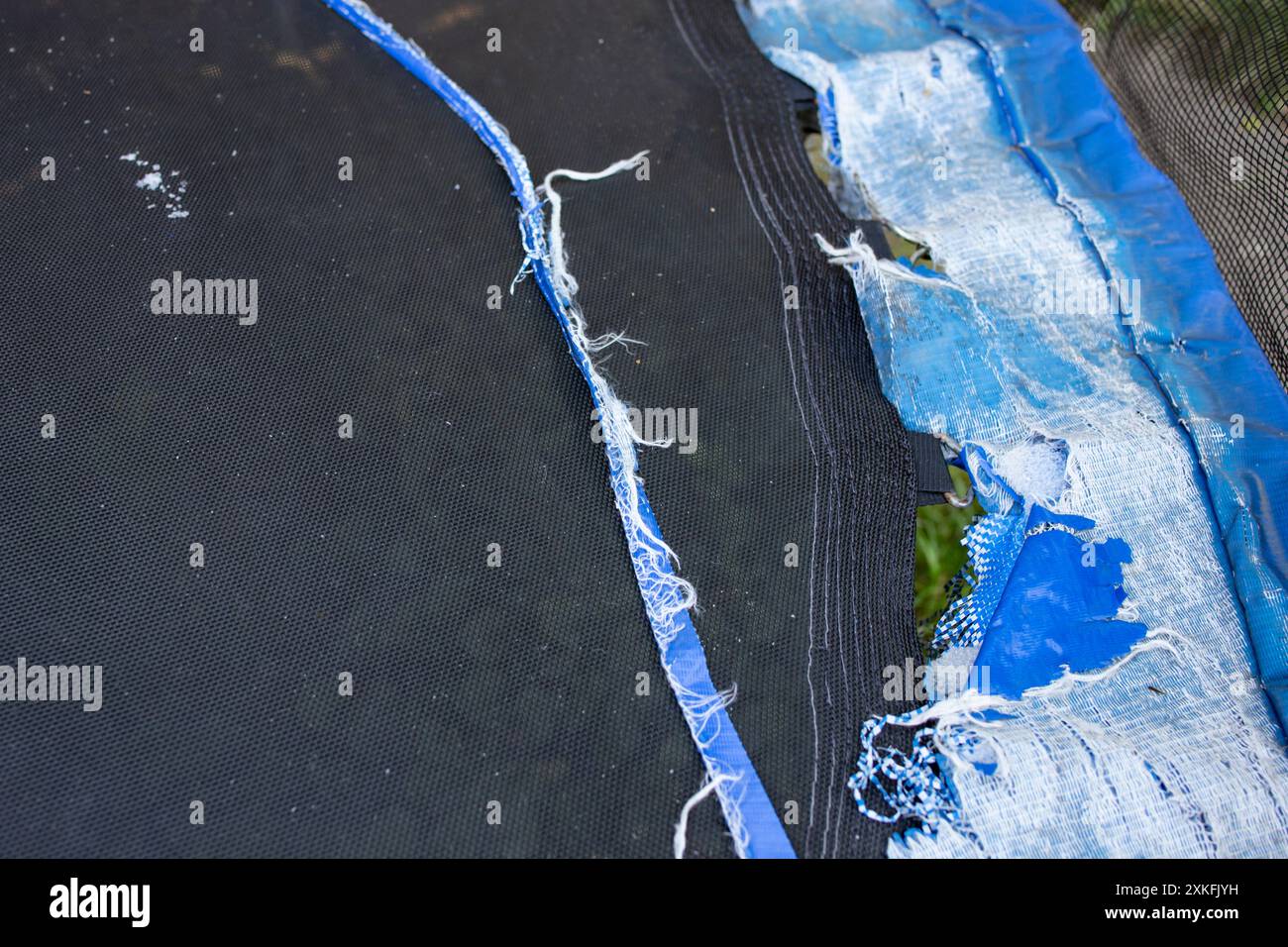 Worn out, obsolete Poly-Tarpaulin blue tarp , spring protection for a ...