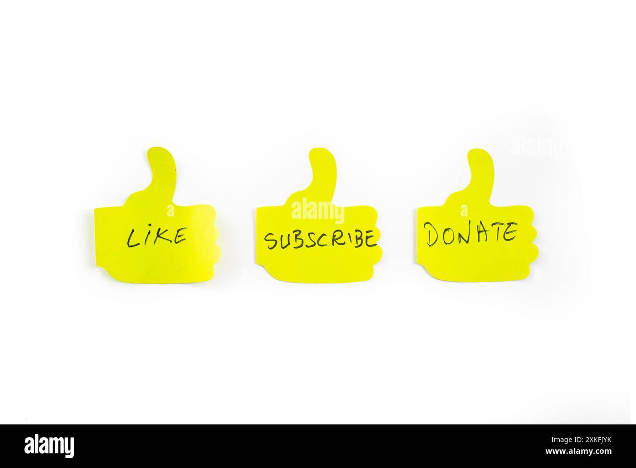Like, subscribe and donate words written on sticky notes of the shape ...