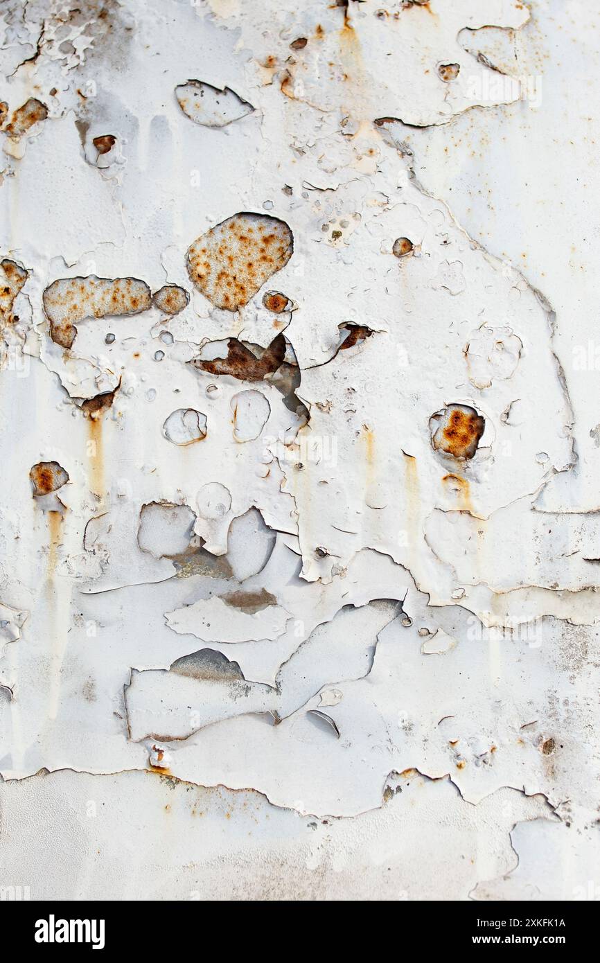 Peeling white paint and rust stains on a abandoned car, close up abstract Stock Photo - Alamy