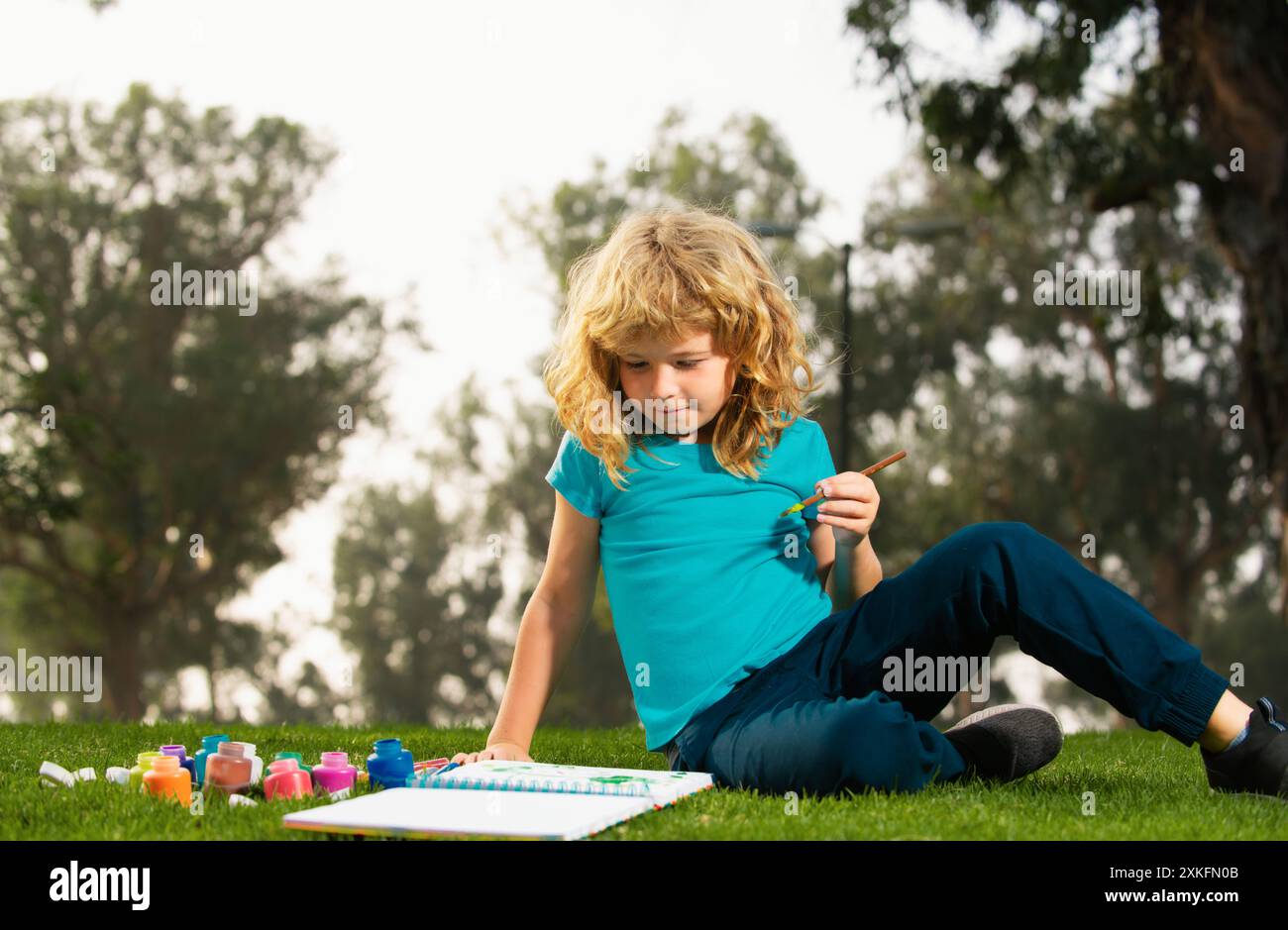 Children draw paint pictures outside, childrens creativity. Kids ...