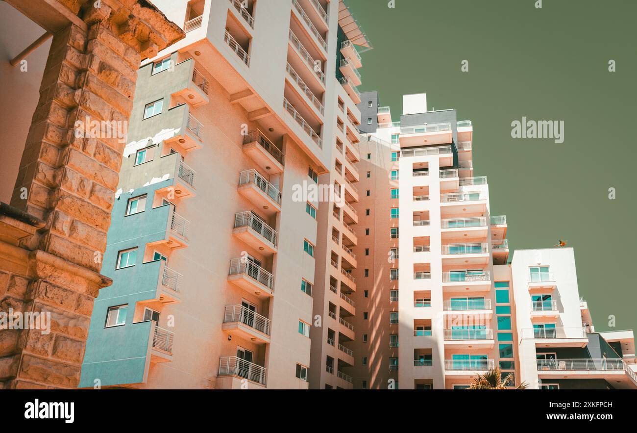 Urban scene featuring modern high-rise apartment buildings with ...