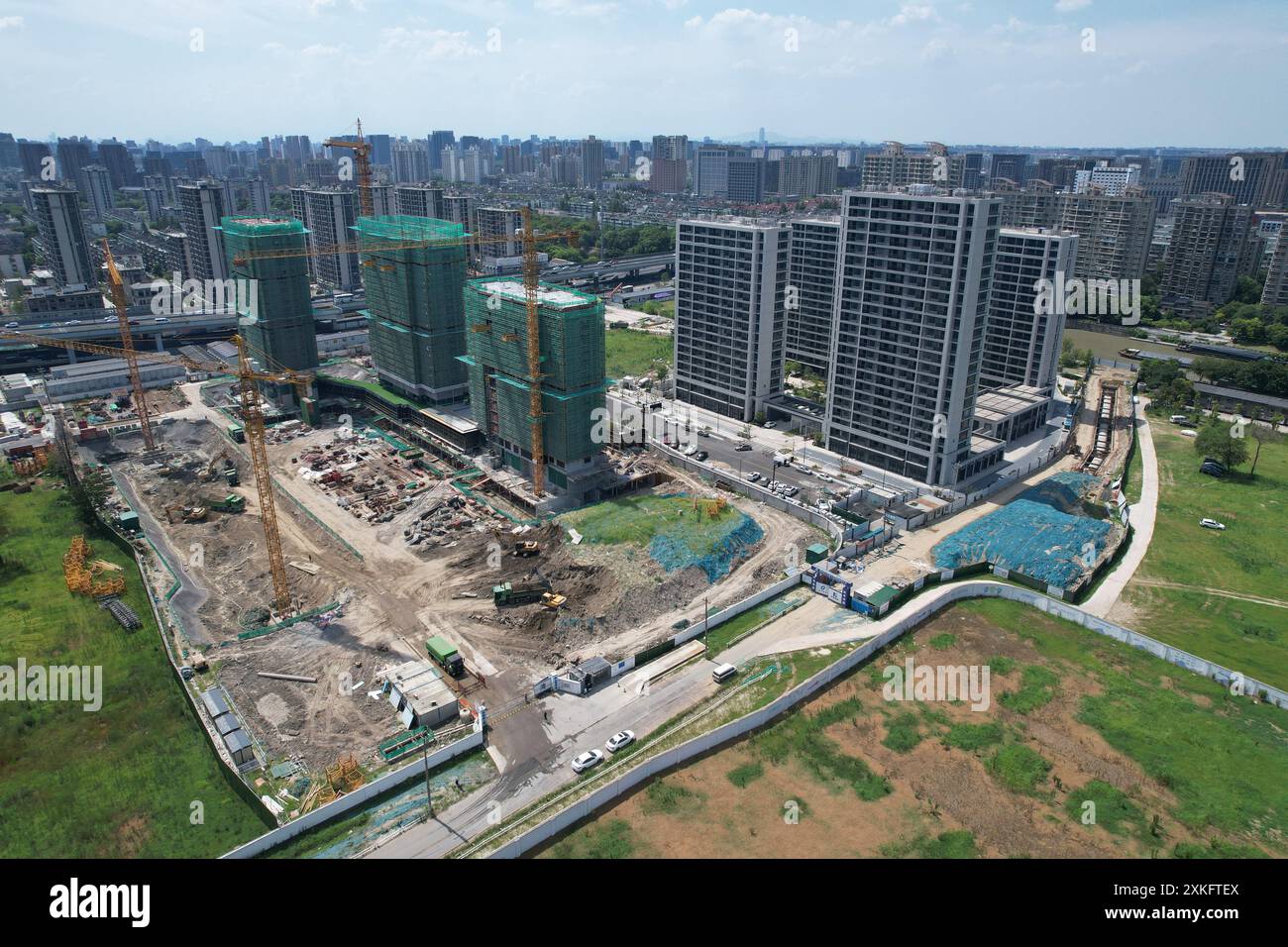 HANGZHOU, CHINA - JULY 23, 2024 - A building under construction and ...