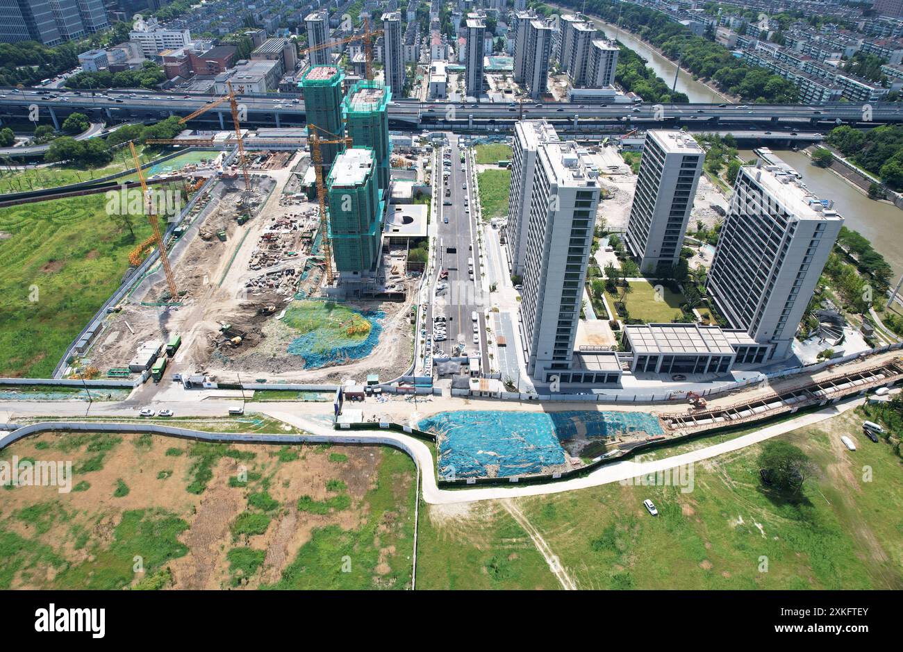 HANGZHOU, CHINA - JULY 23, 2024 - A building under construction and ...