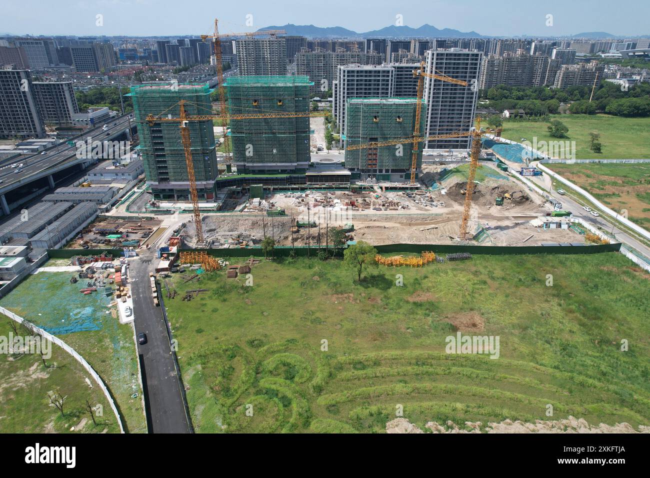 HANGZHOU, CHINA - JULY 23, 2024 - A building under construction and ...