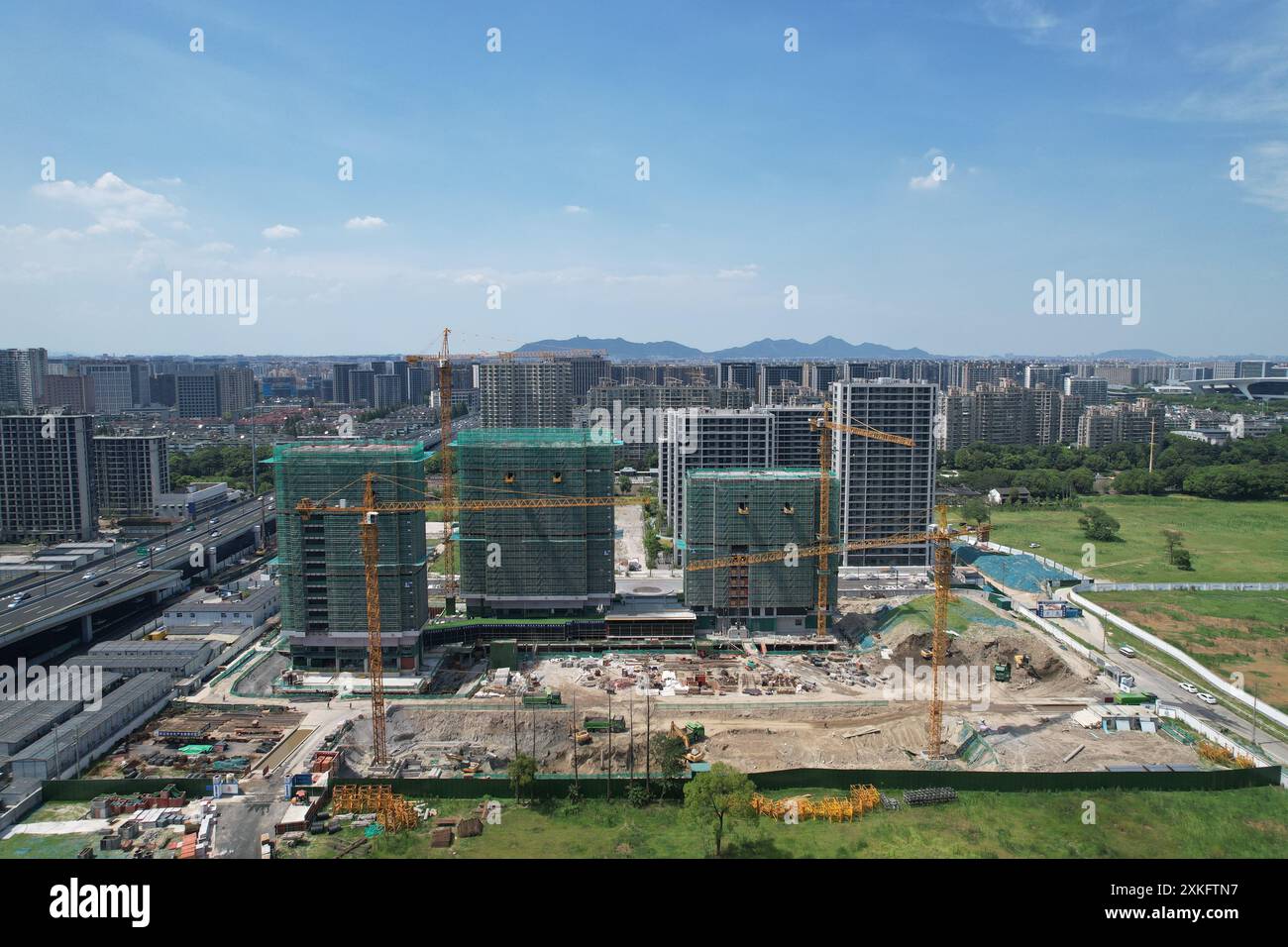 HANGZHOU, CHINA - JULY 23, 2024 - A building under construction and ...