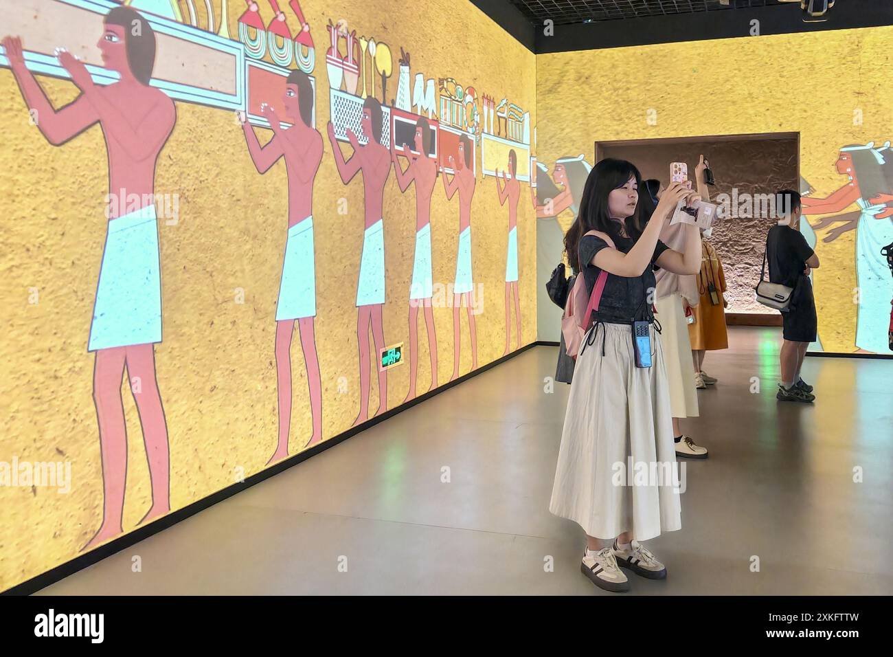 People visit the grand exhibition "On Top of the Pyramid: The ...