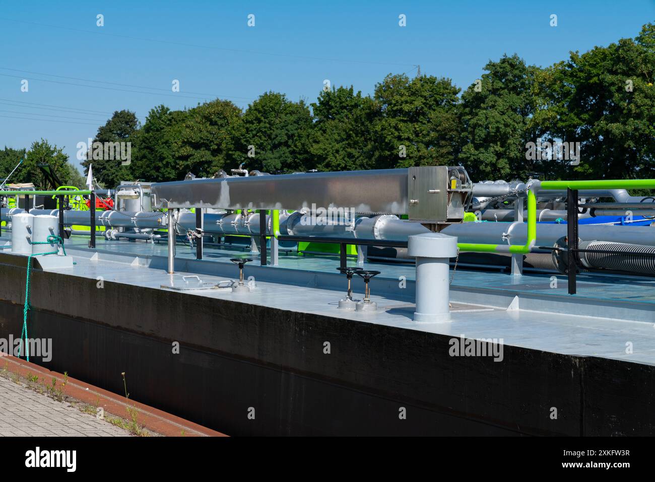 A view of the deck of a barge with various piping and equipment. River ...