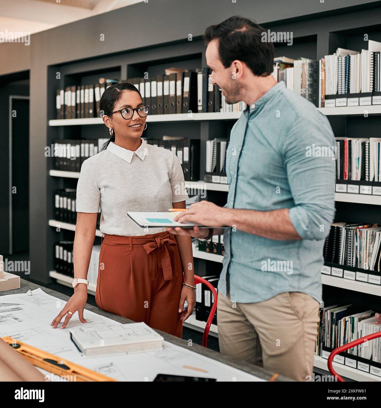 Tablet, blueprint and architects in office for discussion on site ...