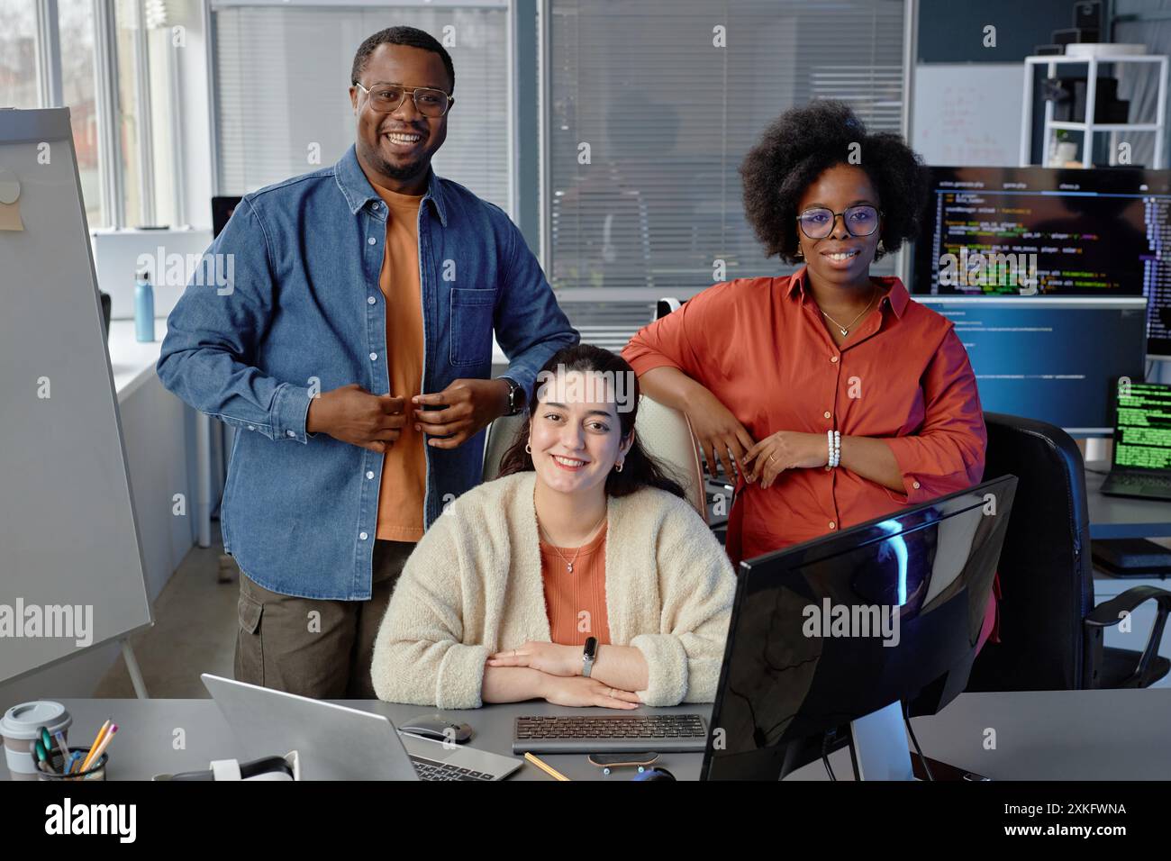Portrait shot of three multiethnic higher-weight people in software engineering Stock Photo - Alamy