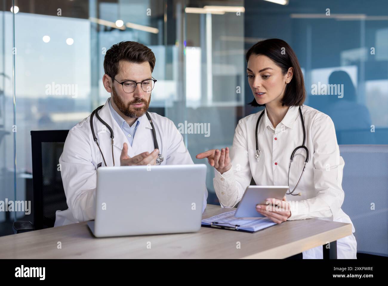 Medical professionals examining digital data hi-res stock photography ...