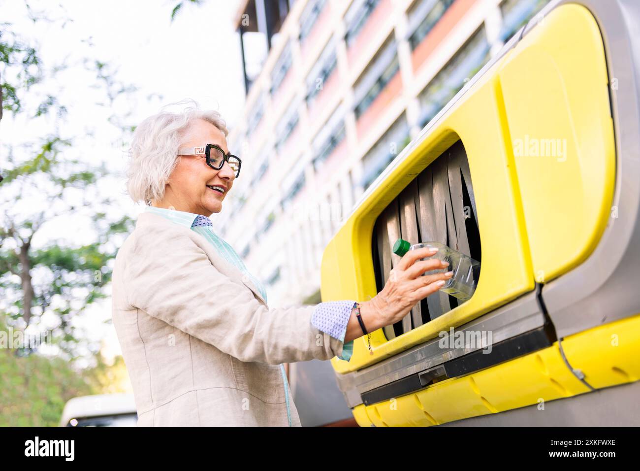 Elderly woman plastic recycle hi-res stock photography and images - Alamy