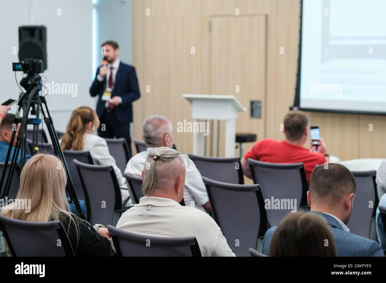 Business presentation held in conference room with speaker addressing ...