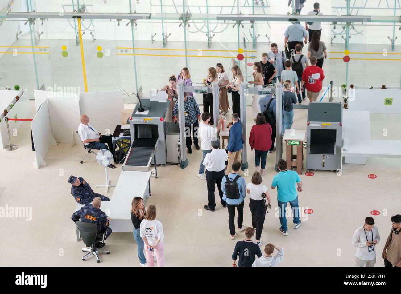 Moscow - April 10,2024: Group of people waiting in line at security ...