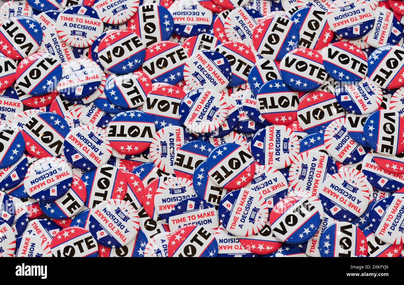 A pile of red, white, and blue "Vote" buttons encouraging decision ...