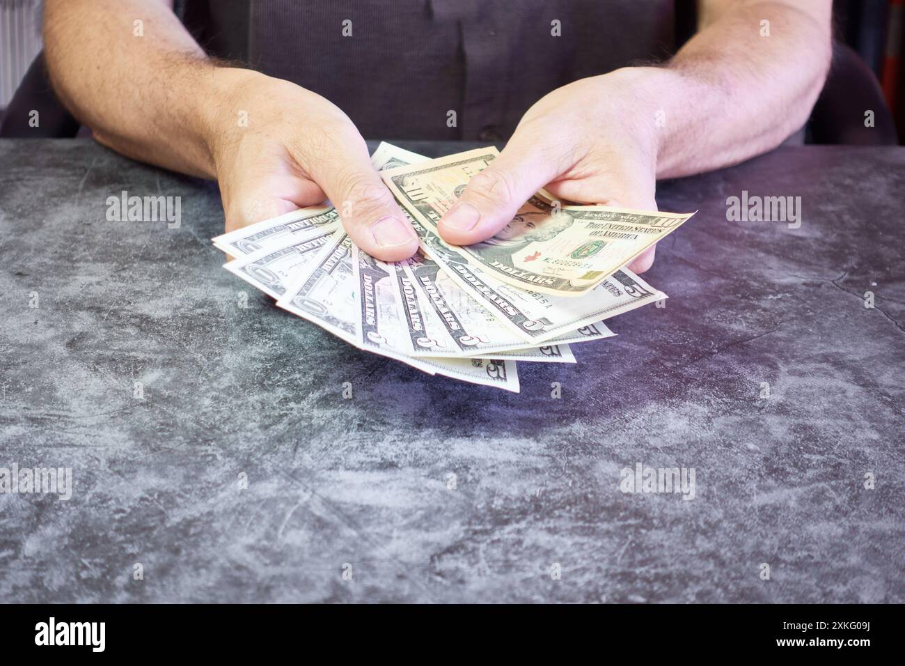 Mans hands counting dollar banknotes hi-res stock photography and ...