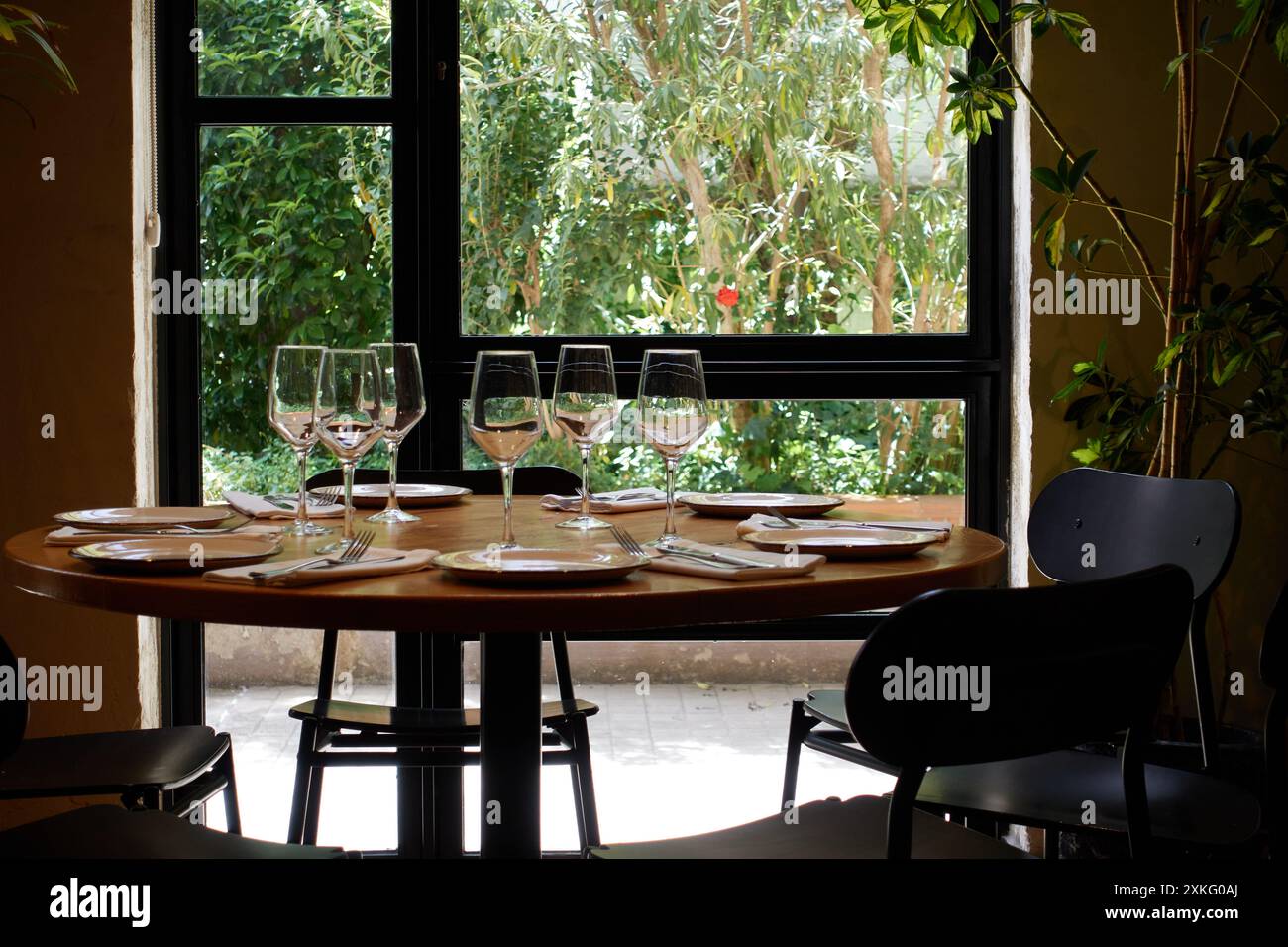 Restaurant table prepared and without people, with unused glasses and ...