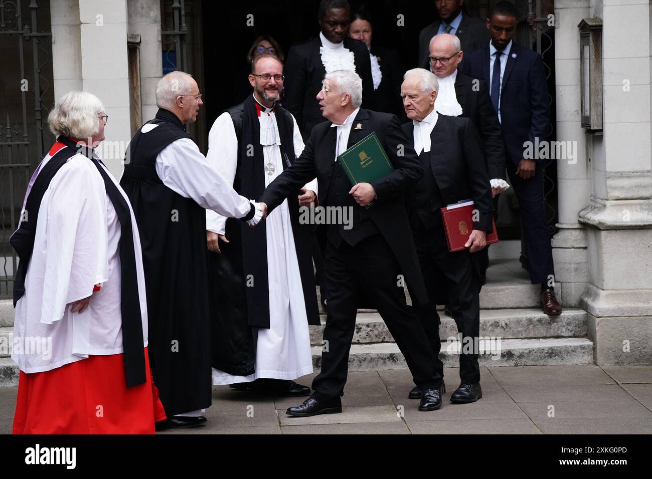 Speaker of the House of Commons Sir Lindsay Hoyle (centre) shaking ...