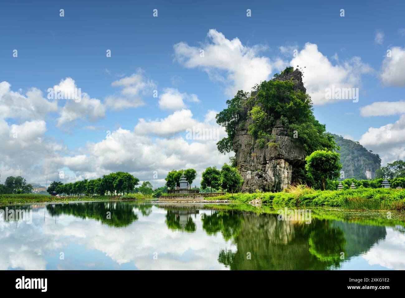 Beautiful natural karst tower reflected in the Ngo Dong River Stock ...
