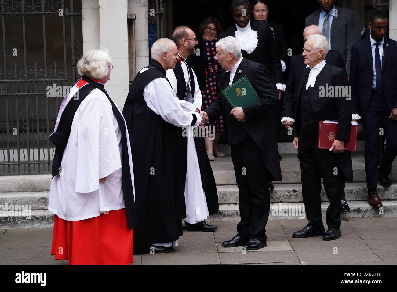 Speaker of the House of Commons Sir Lindsay Hoyle (centre) shaking ...