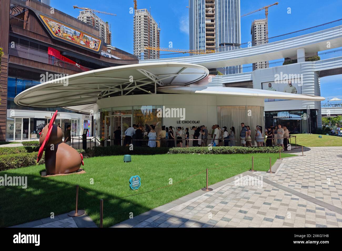 Shanghai, China. 23rd July, 2024. Tourists are lining up at Louis ...